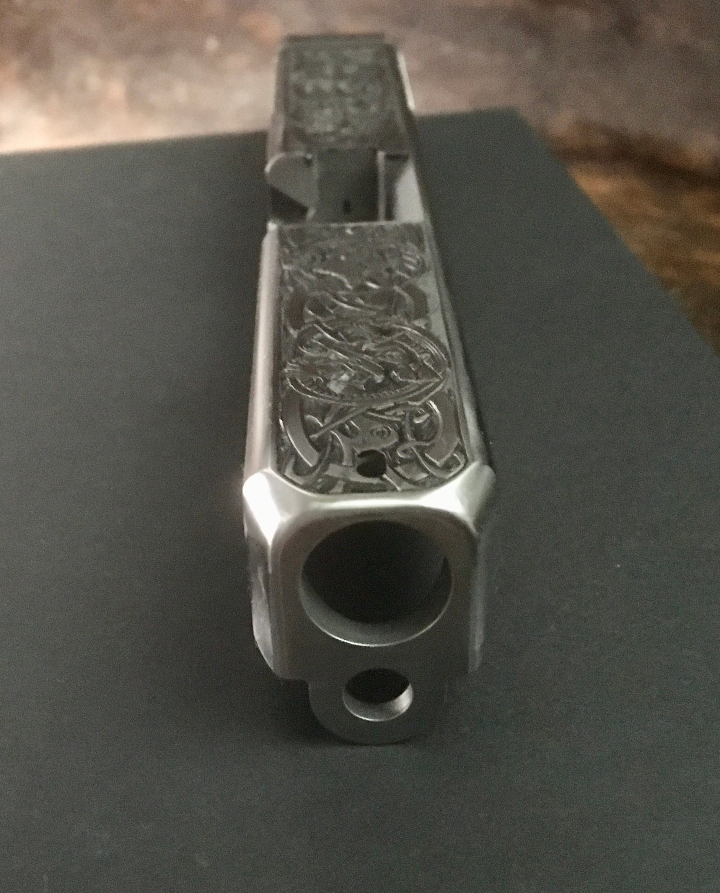 Hand engraved Glock slide | Custom Engraving on guns and knives