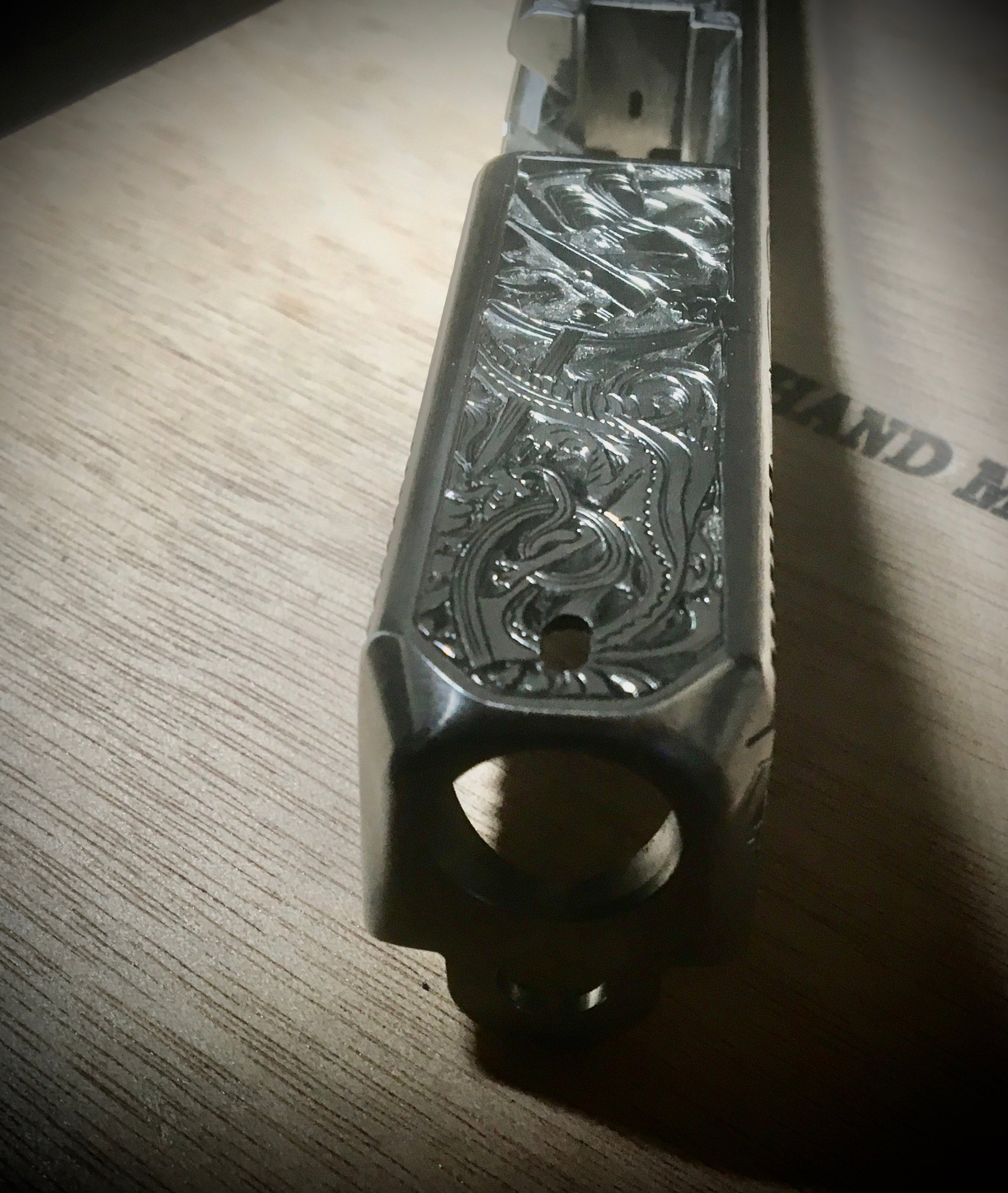 Hand engraved Glock slide | Custom Engraving on guns and knives